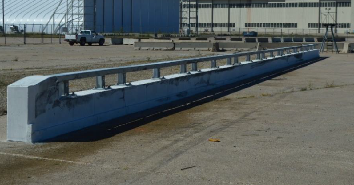 MASH 2016 Test Level 4 Evaluation of MnDOT Concrete Parapet with Brush ...